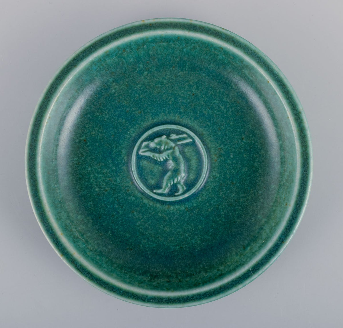 Saxbo, Denmark. Small ceramic bowl with a motif of a standing bear. Mi ...